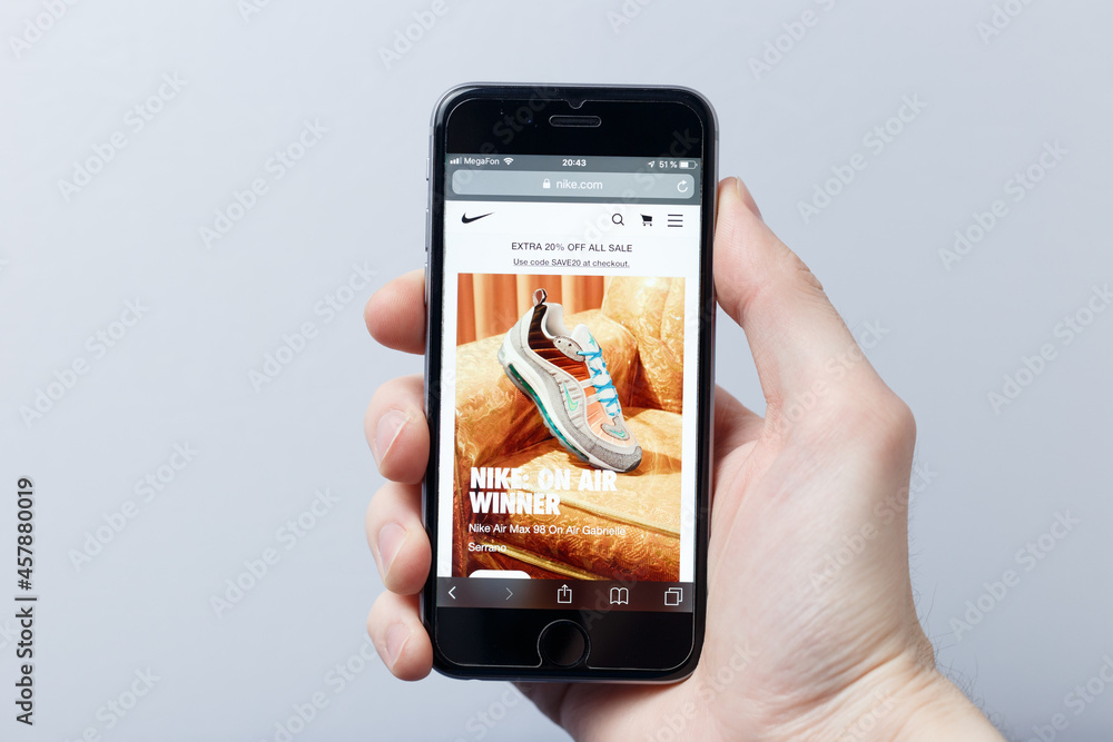 New York / USA - 04.14.2019: A hand holding a smartphone which displays ...