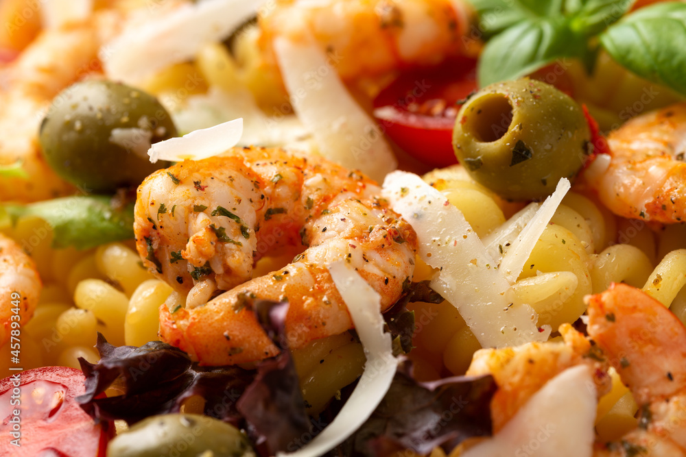 King prawn pasta salad with marinated green olives, cherry tomatoes and ...