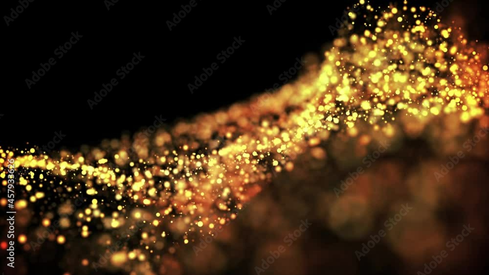 gold glowing particles flow in viscous liquid and bright glisten ...