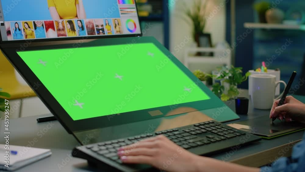 Close up of horizontal green screen on computer with retouching app ...