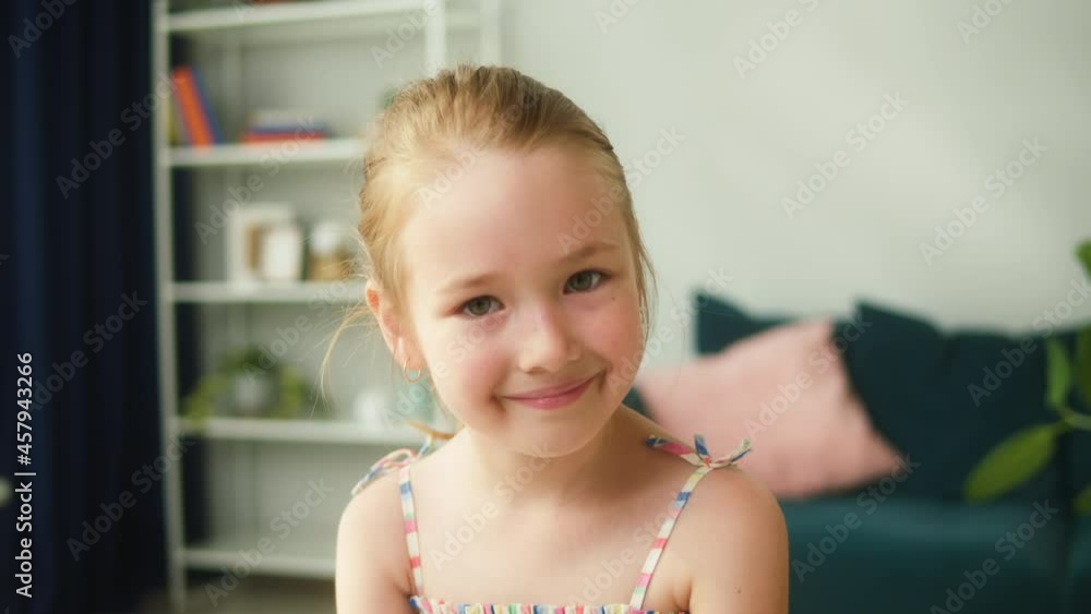 Little girl portrait. Smiling female child looking in camera. Red ...