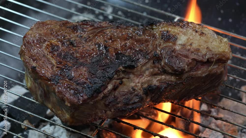 Rib eye steak beef Grill with Butter and garlic on the Flames, Beef ...
