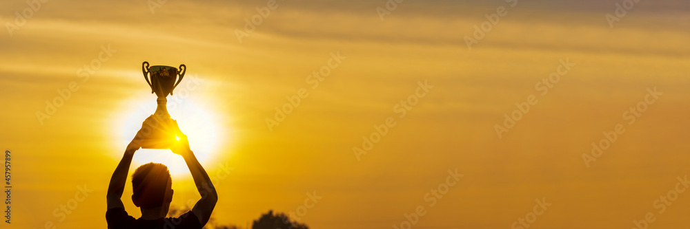 Banner Winner win hands holding golden champion trophy cup prize ...