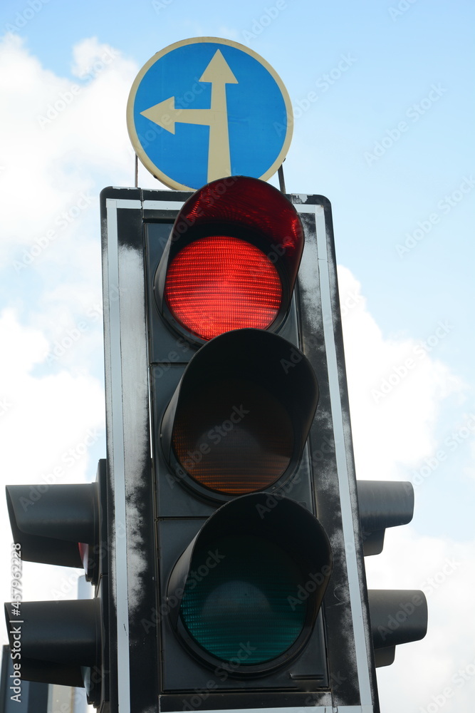 Red traffic light and Go straight or left sign. Mandatory signs. Road ...