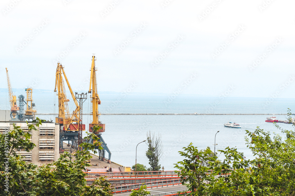 seaport with tanks and cranes and other equipment. Stock Photo | Adobe ...