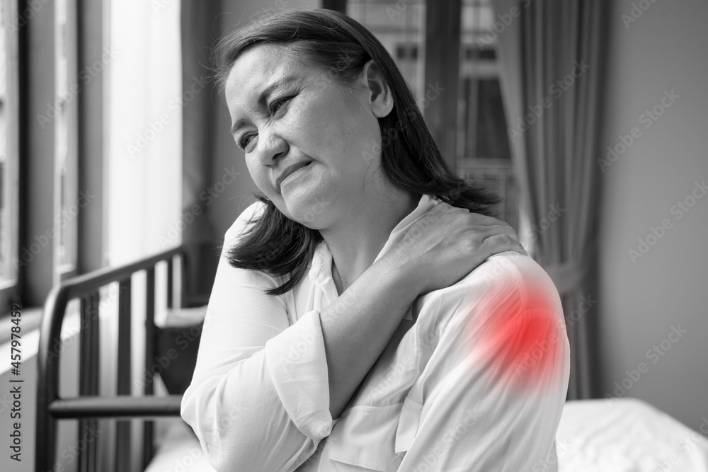 Vaccinated asian middle aged woman suffering from vaccine side effect ...