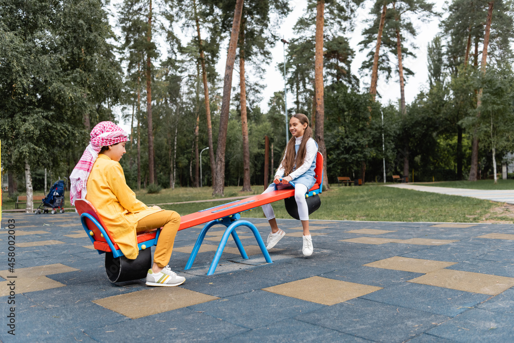 Arabian children playing on playground in park Stock Photo | Adobe Stock