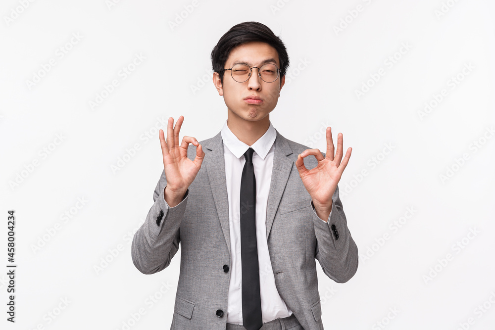 Waist-up portrait of smart successful, handsome asian man rate ...