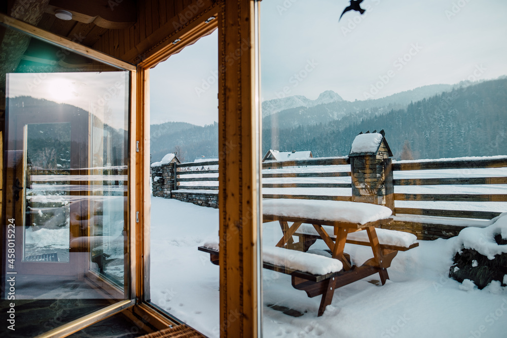 Wooden Cottage House Window. Beautiful snowy winter morning behind the ...