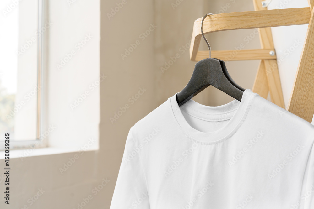 Plain white cotton t-shirt on hanger for your design Stock Photo ...