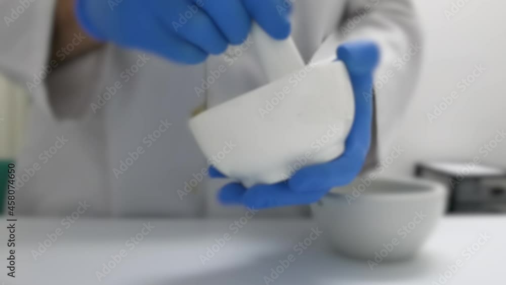Pharmacist preparing an ointment in the prescription laboratory of a ...