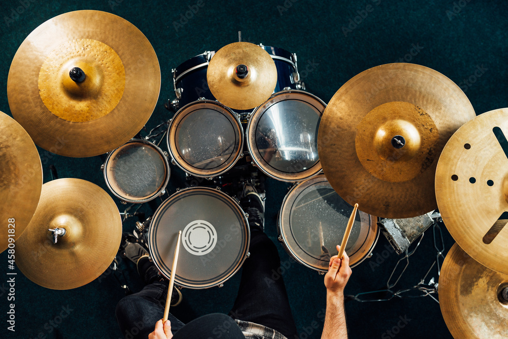 Drummer playing complete drum kit top view. Stock Photo | Adobe Stock