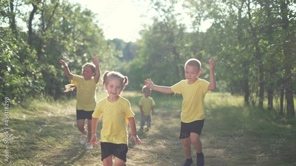 Kid are run. Child run through forest park to finish line. Victory and ...