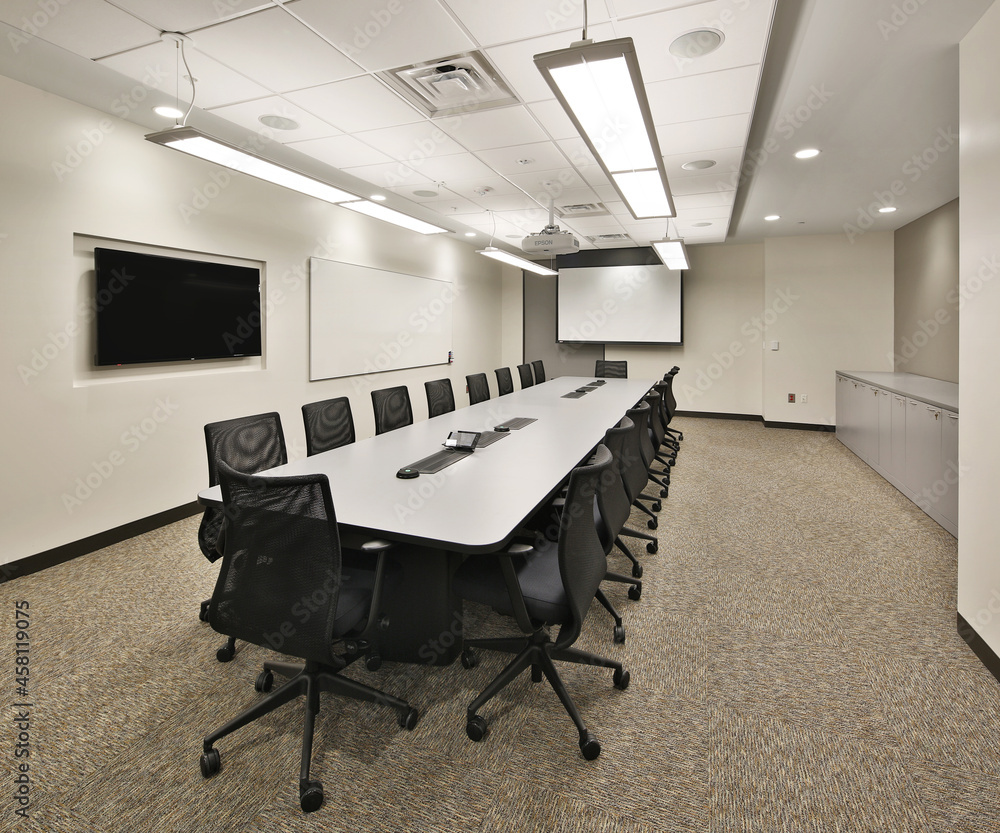 Interior of modern office business conference meeting room with screens ...