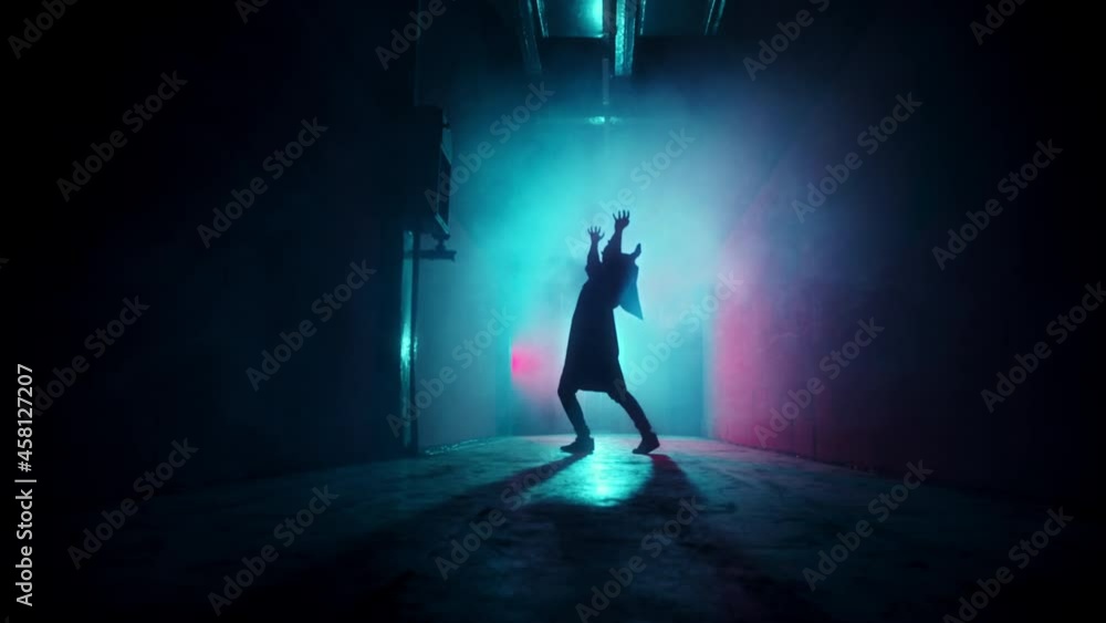 Vídeo do Stock: Demon with horns conjuring in corridor. Silhouette of ...