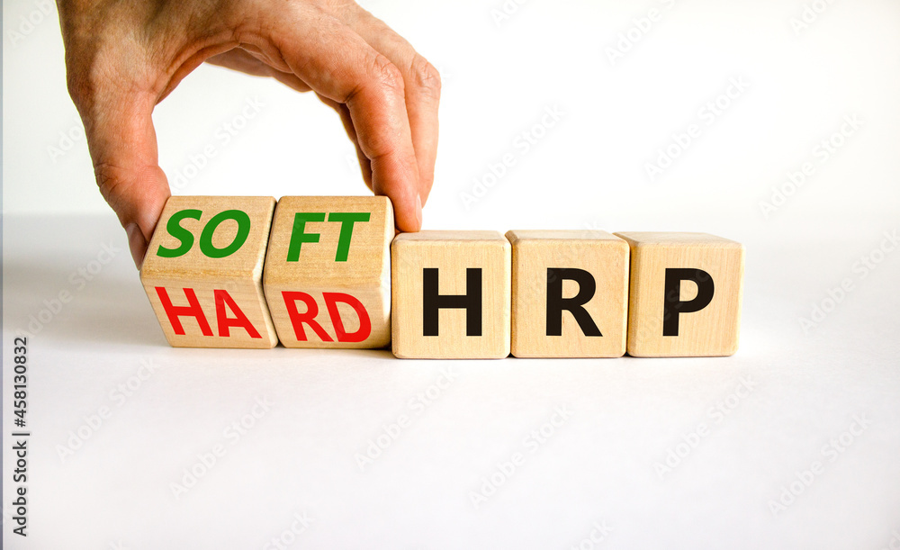 HRP, human resource planning symbol. Businessman turns wooden cubes and ...