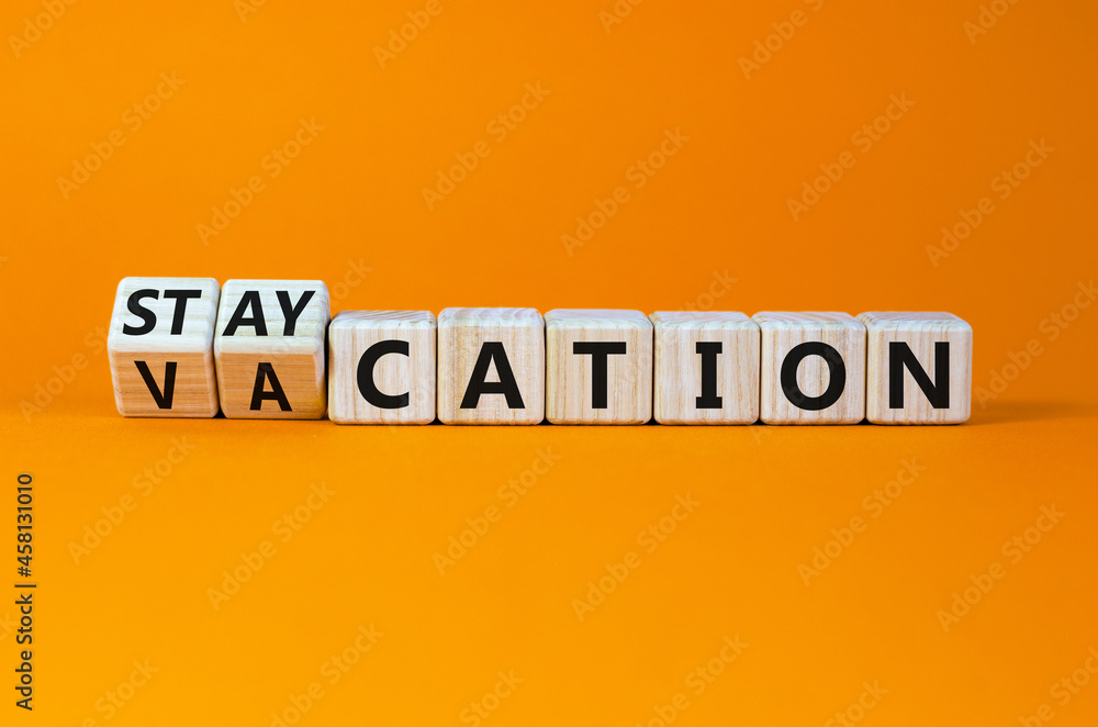 Vacation or staycation symbol. Turned wooden cubes and changed the word ...