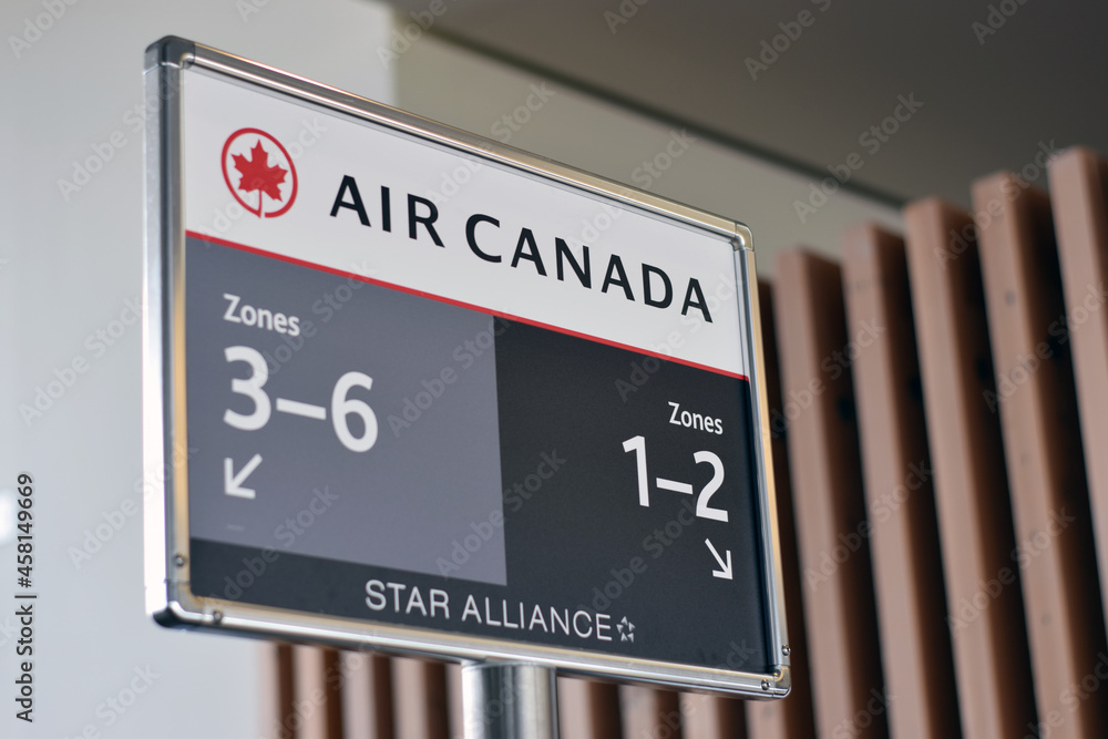 Air Canada boarding sign at an airport that helps passengers board ...
