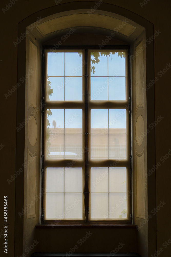 Windows inside historic classic old building house palace with archways ...