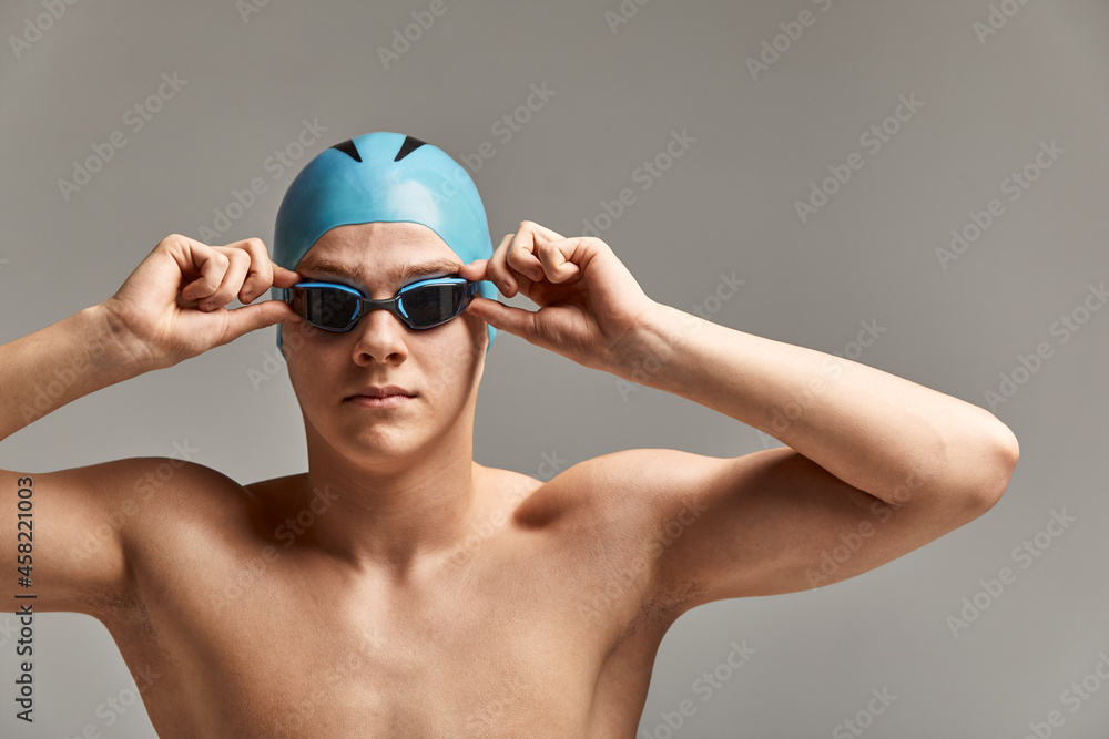 Portrait of a swimmer in a cap and mask, half-length portrait, young ...