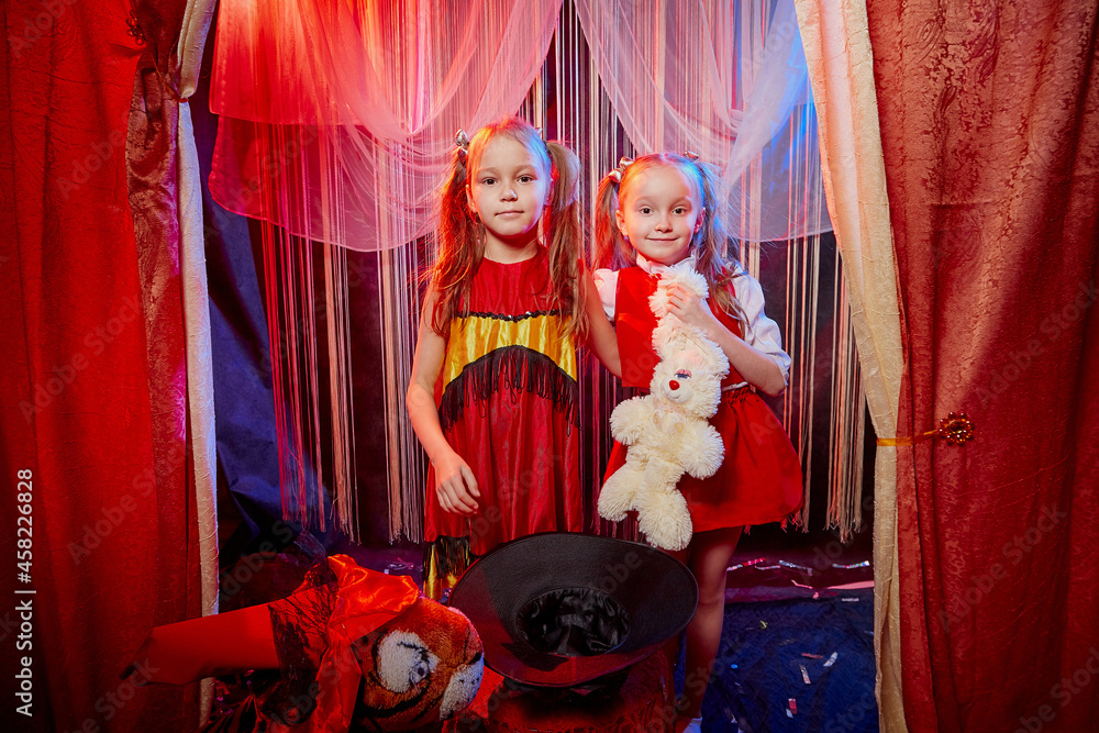 Small girls during a stylized theatrical circus photo shoot in a ...