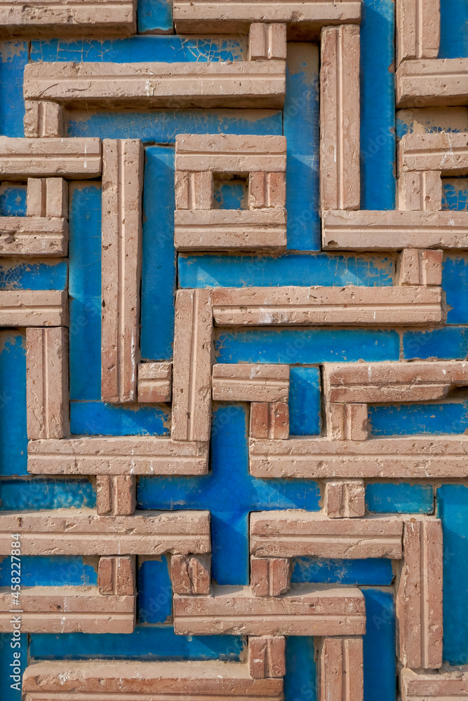 Beautiful brick and blue ceramic tile design with swastika pattern on ...