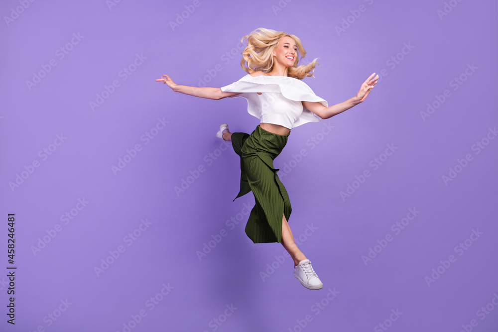 Full length body size photo blonde girl jumping up smiling doing ...