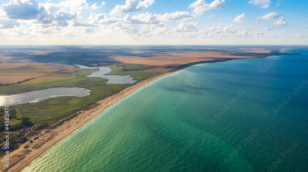 Aerial view of beautiful empty wild beach with turquoise sea waters and ...