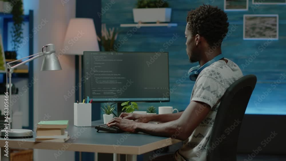 Programmer using binary code for website interface development on computer. Person coding system ...