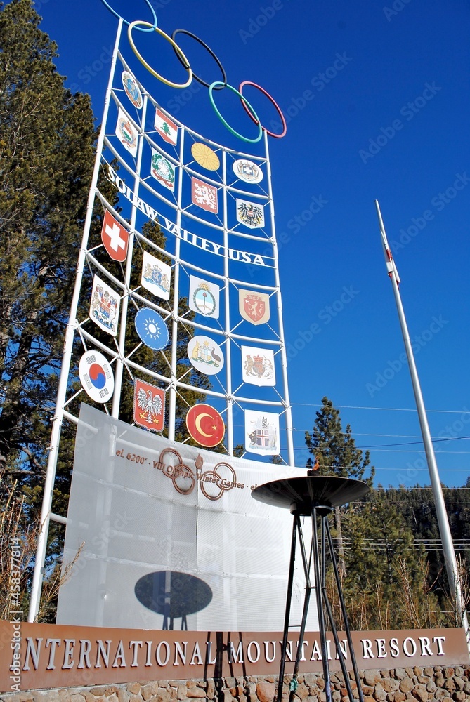 Olympic Valley, California -2016: Olympic flame, international flags ...