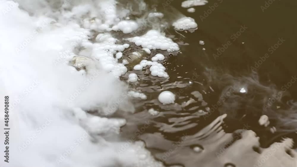 Chemical contamination of water. Dry ice bubbles in a puddle. Chemical ...