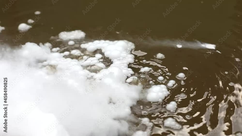 Chemical contamination of water. Dry ice bubbles in a puddle. Chemical ...