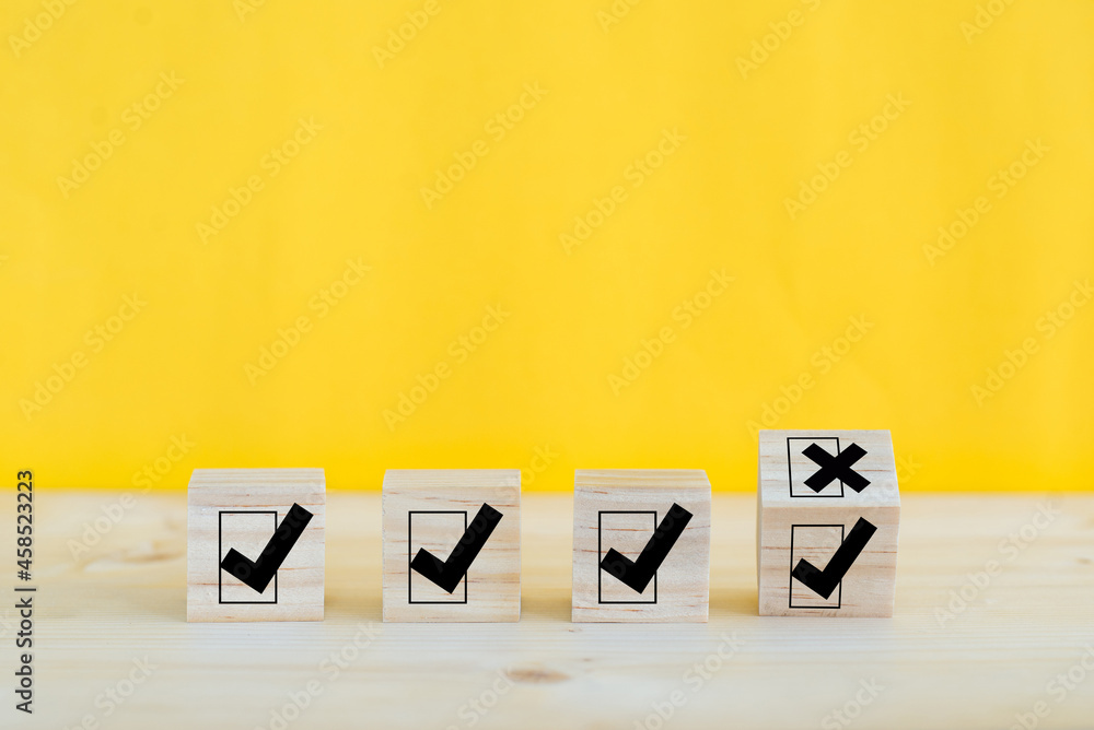 Checklist Survey and assessment concept. Cube wood with Check mark icon ...