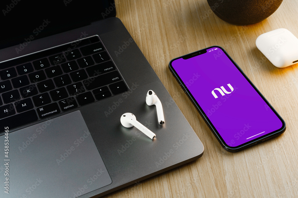 Nubank app on the smartphone screen on wooden background with a ...