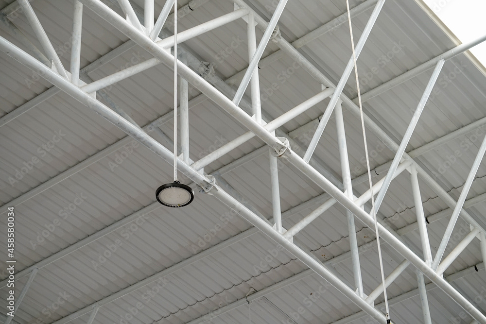 a steel roof in a giant building. a high white roof that is most ...