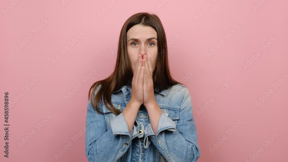Scared shocked young brunette woman 20s years old look camera covering ...