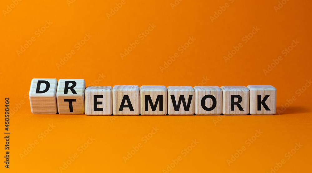 Teamwork and dream work symbol. Turned wooden cubes and changed the ...