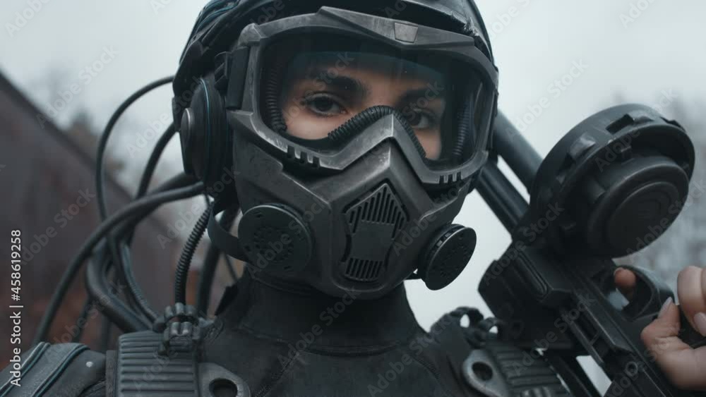 Portrait female future soldier in fiction helmet after nuclear war ...