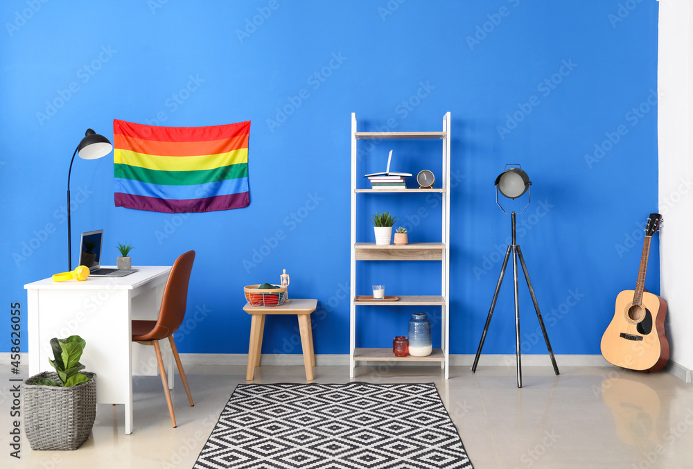 Interior of room with modern workplace and flag of LGBT Stock Photo ...