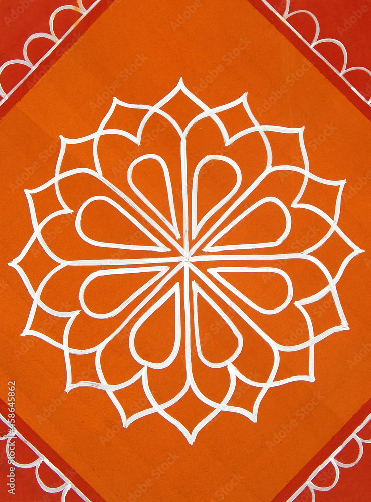 Indian Hindu traditional rangoli drawing on the wall of rural house ...