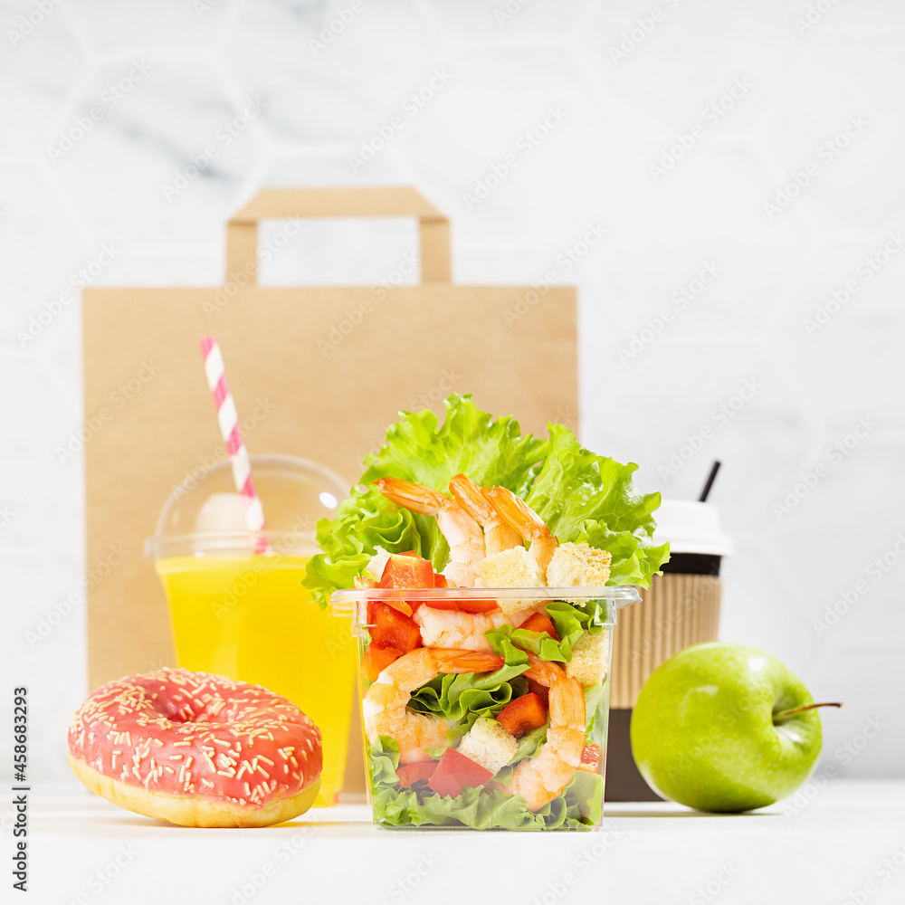 Bright lunch set of seafood shrimp salad in pack, orange juice, coffee ...