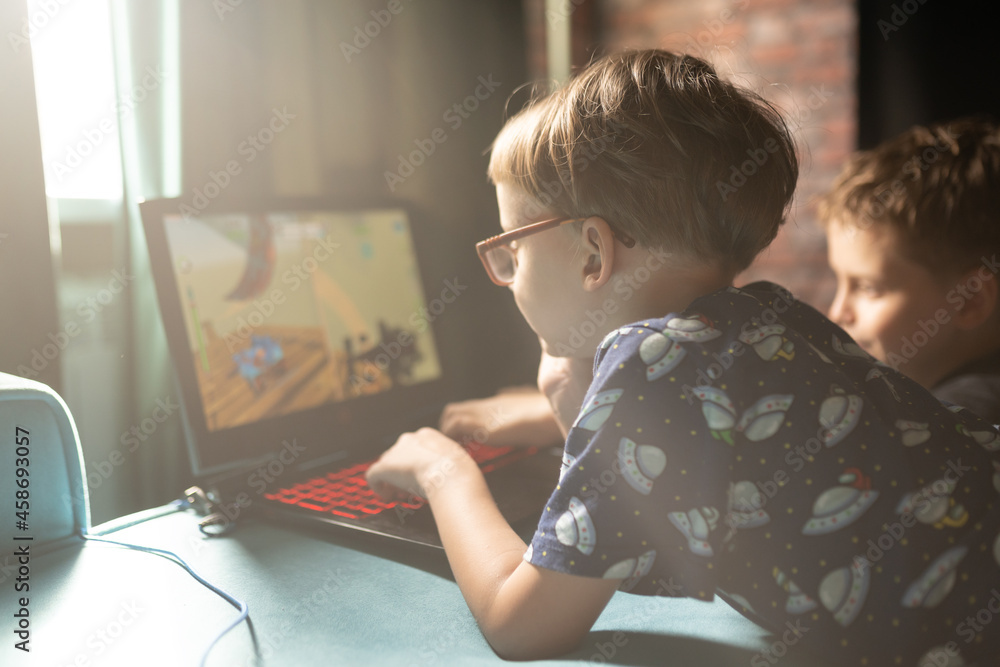 two boys playing in online game Stock Photo | Adobe Stock