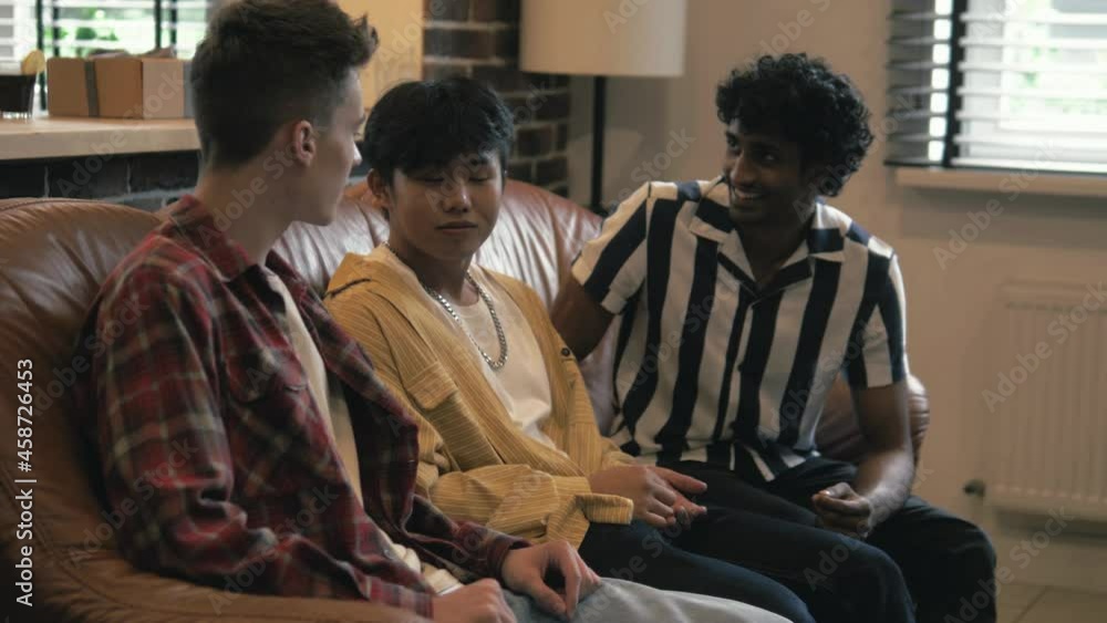 Happy guys talking discussing together. Friends having nice ...