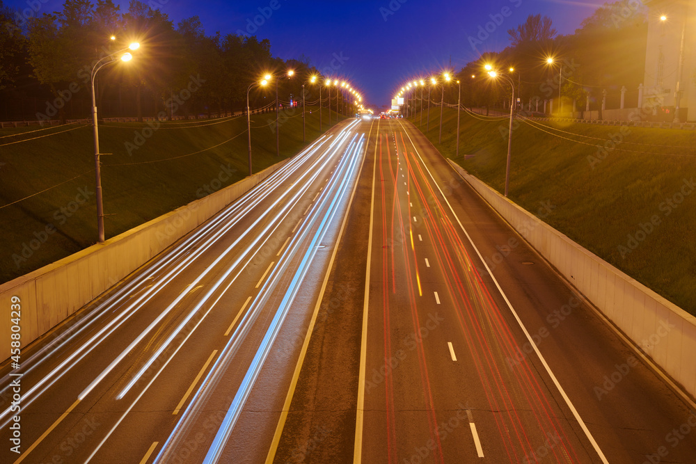 Night highway road with cars lights. Yellow and red light trail on the ...