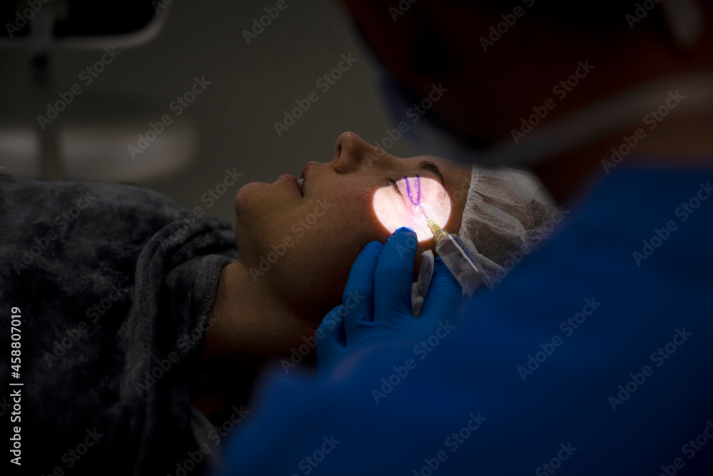 Surgeon process of blepharoplasty surgery.Apply anesthesia in eyelid ...