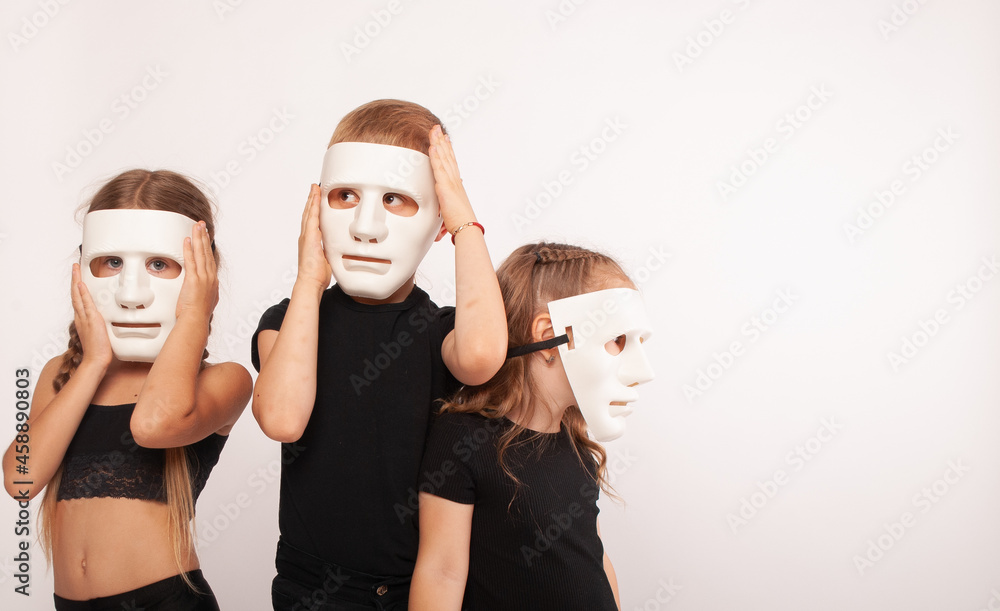 children actors in isolation on a white background in white masks on ...