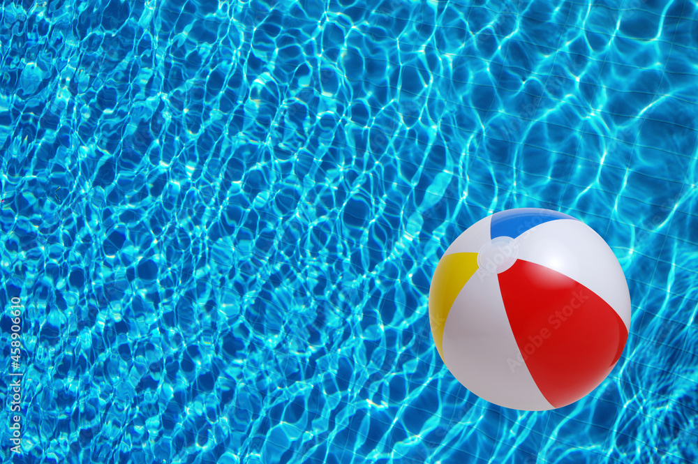 Beach ball in swimming pool Stock Photo | Adobe Stock