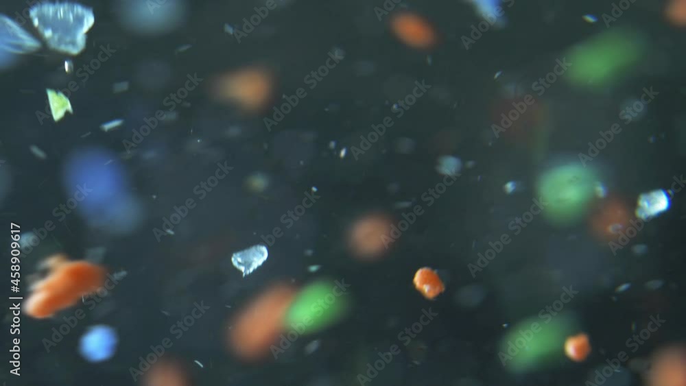 microplastics in water, tiny multicolored plastic bits. global ocean ...