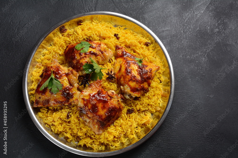 The national Saudi Arabian dish chicken kabsa with roasted chicken ...