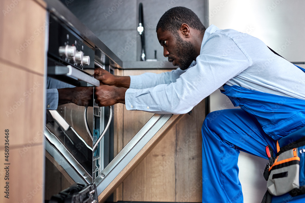 Professional Afro Handyman Or Contractor Repairing Dishwasher, Need To ...